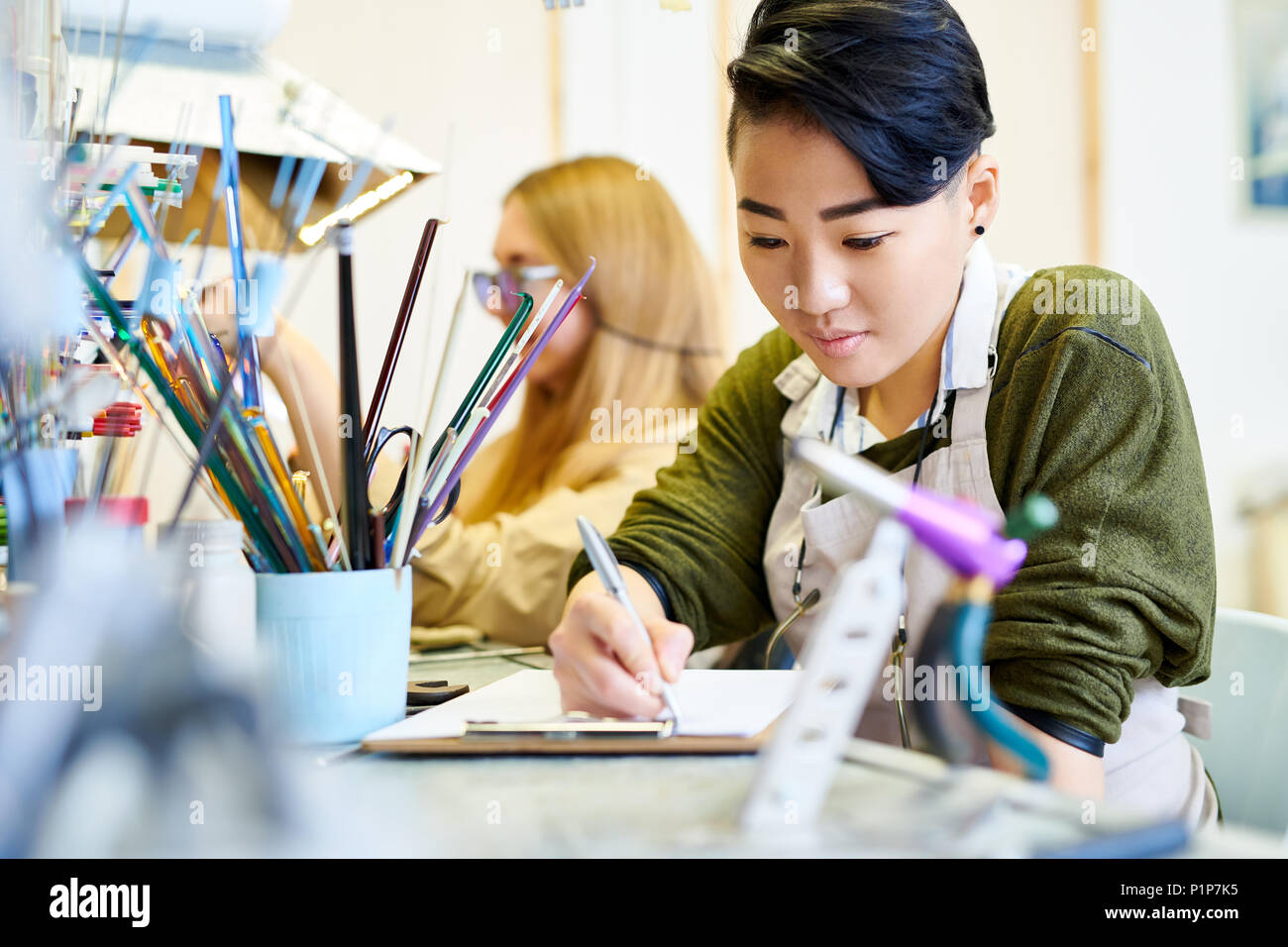 Creative Woman Drawing in Workshop Stock Photo - Alamy