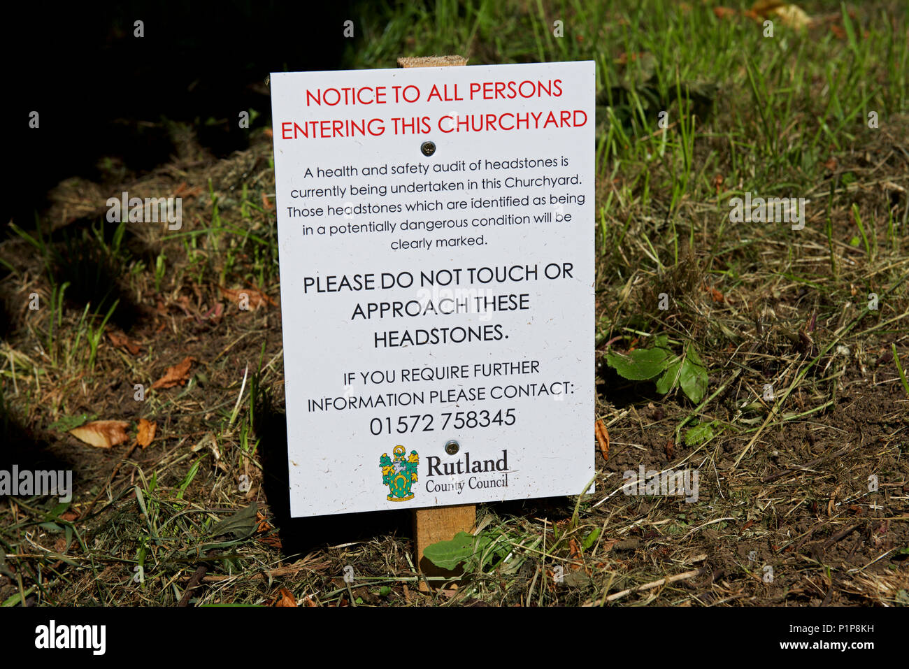 Notice in the churchyard, warning visitors that some headstones are ...