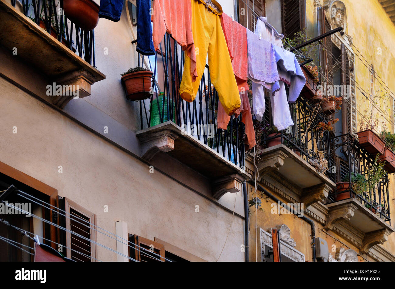 laundry drying in the street Stock Photo - Alamy
