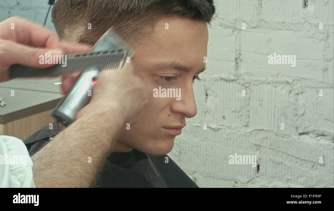 Hairdresser cutting trimmer hair man hi-res stock photography and ...