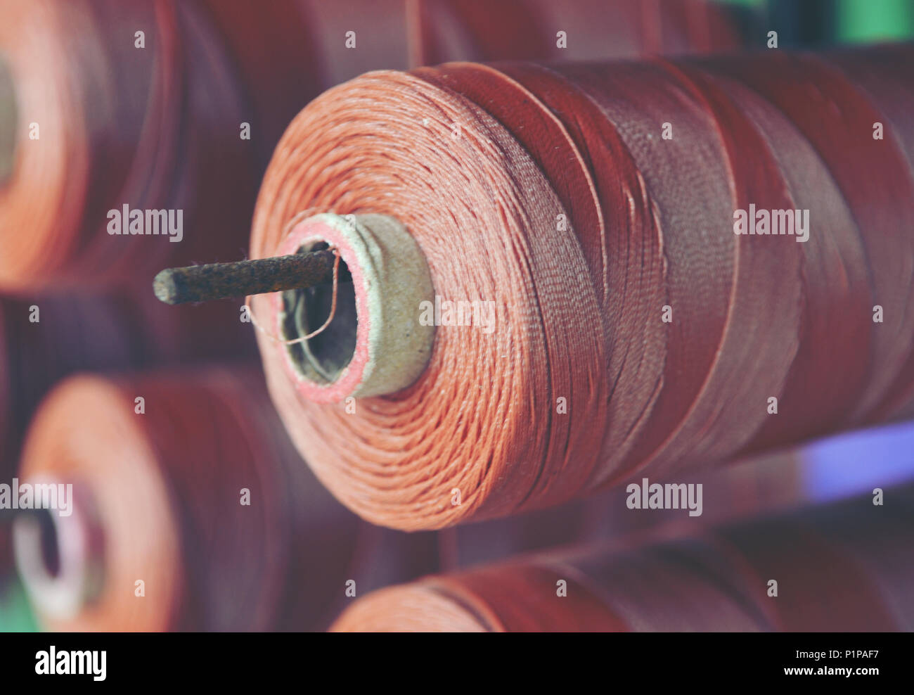 Brown yarn cone mounted in a fabrics factory Stock Photo - Alamy