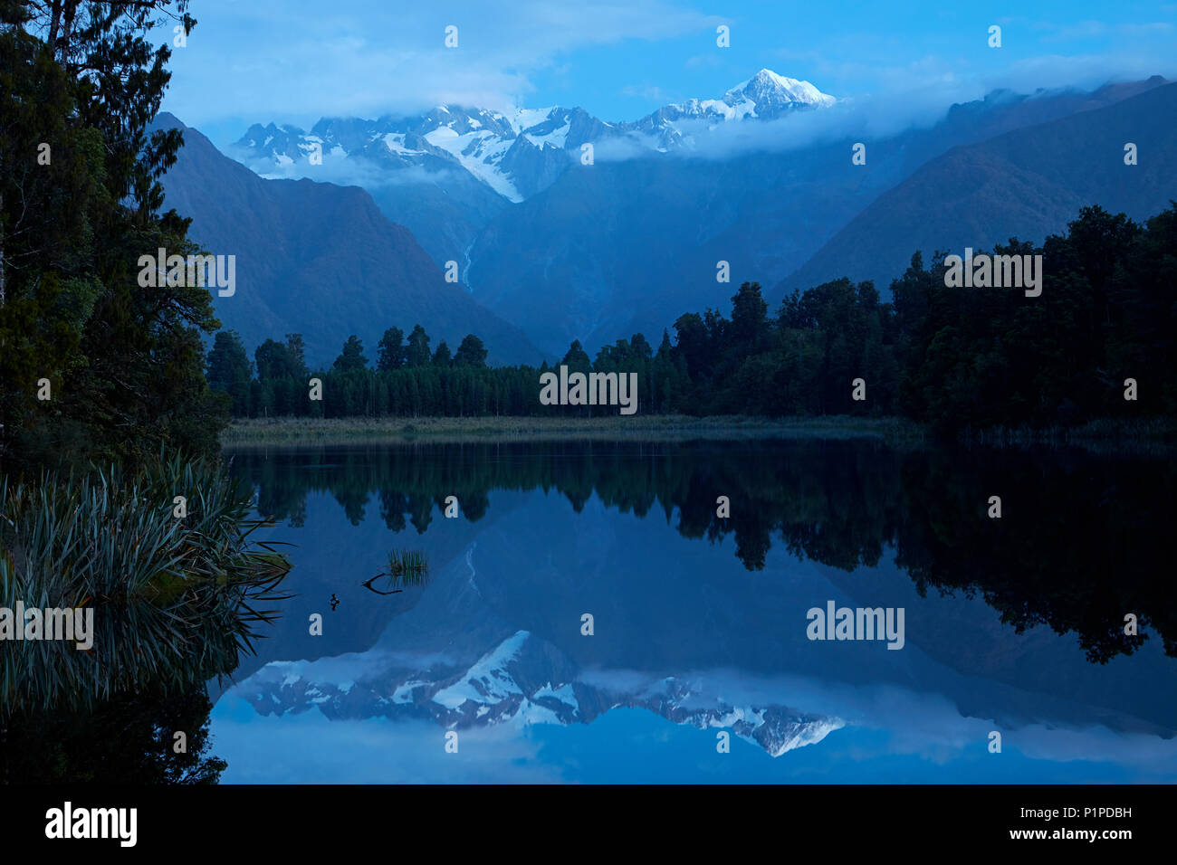 Summits of Mt Tasman (left) and Aoraki / Mt Cook (right) reflected in ...