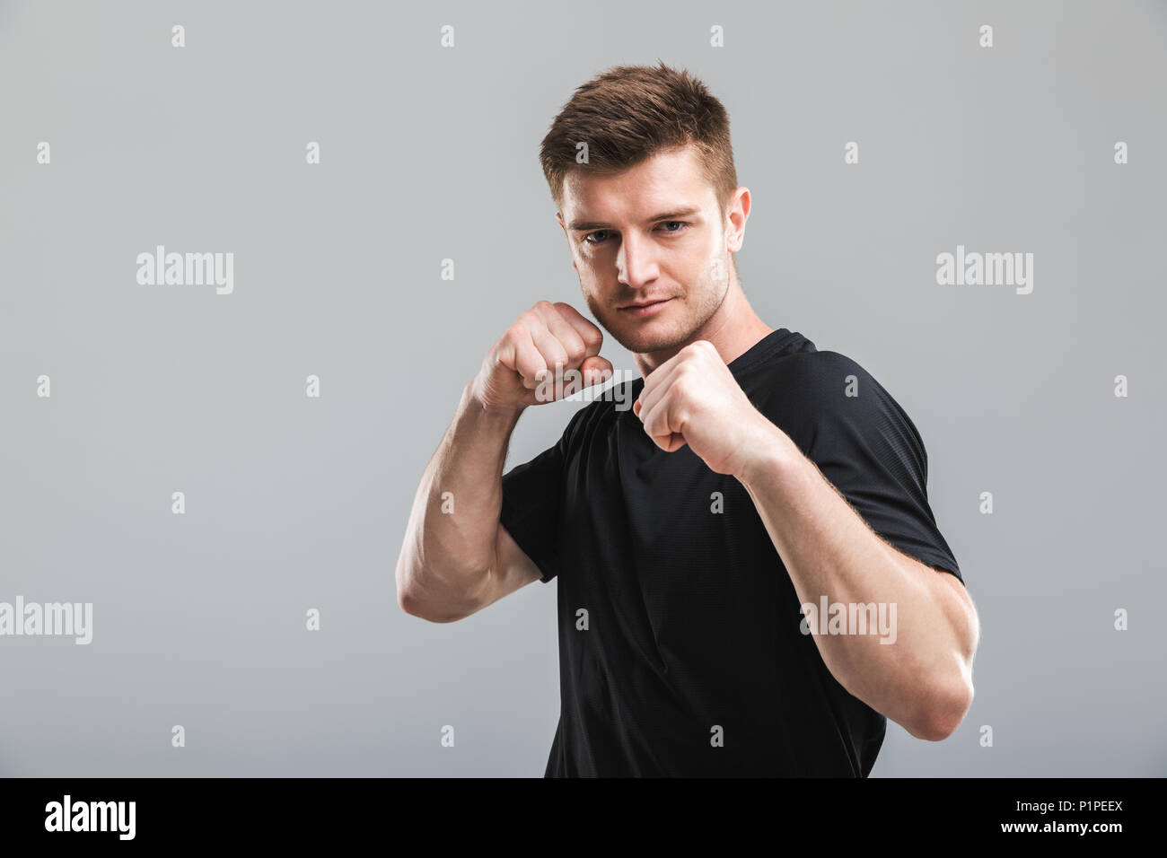 Young man boxing fighting pose hi-res stock photography and images - Alamy