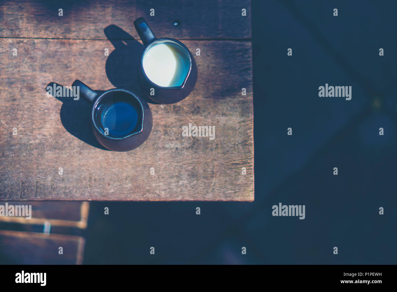 milk and syrup on cafe table Stock Photo - Alamy