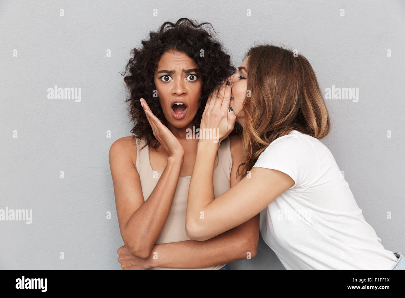 Women women telling secrets hi-res stock photography and images - Alamy