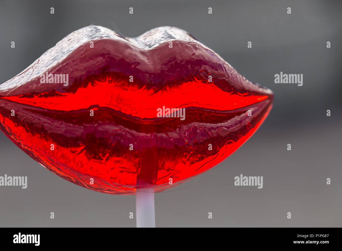 big beautiful red lollipop on a stick Stock Photo - Alamy