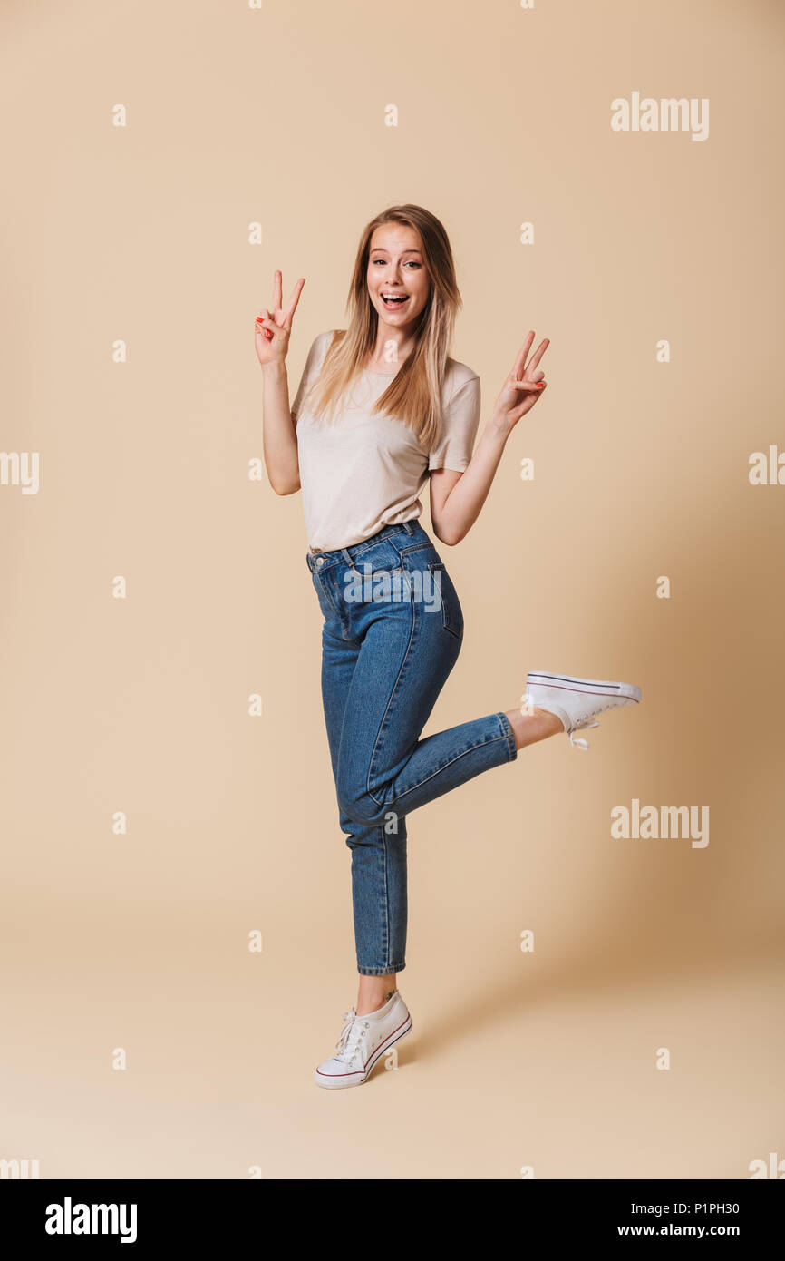 Full length portrait of satisfied young woman 20s wearing casual ...