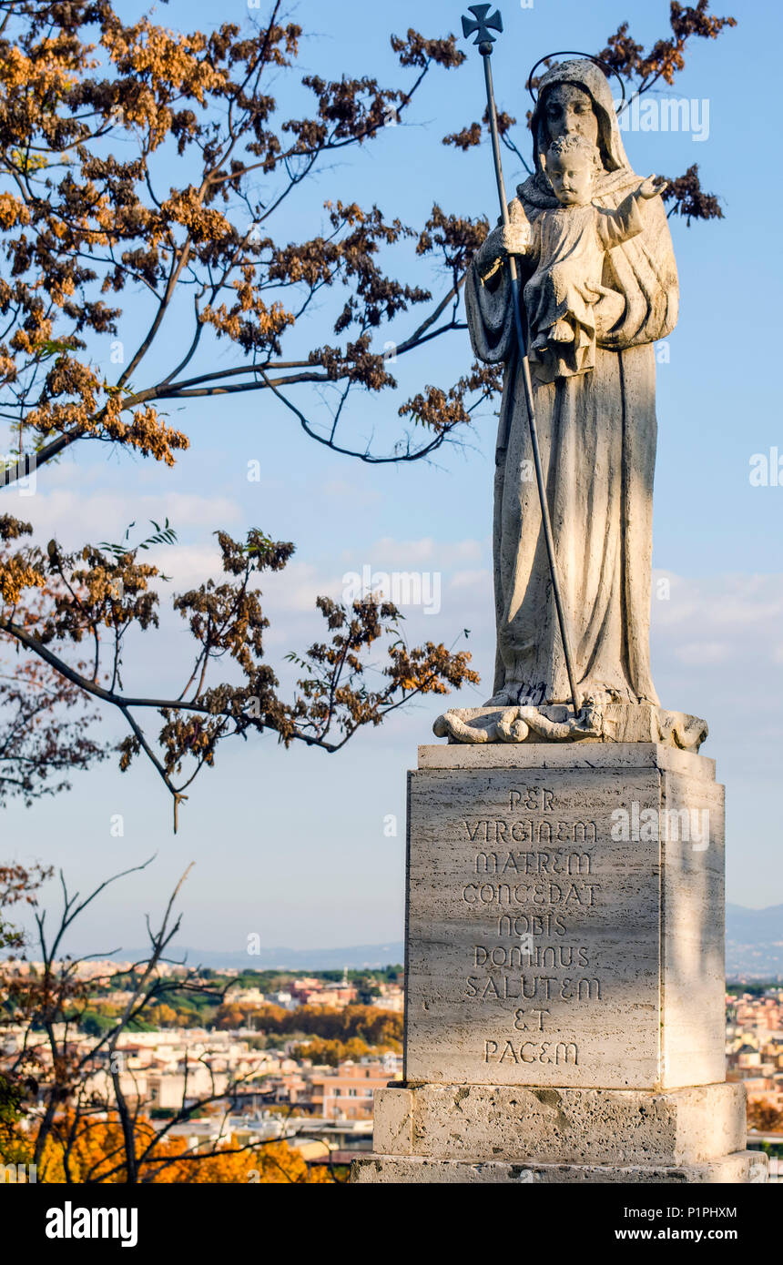 Statue of Virgin Mary and child with city in background; Monteverde ...