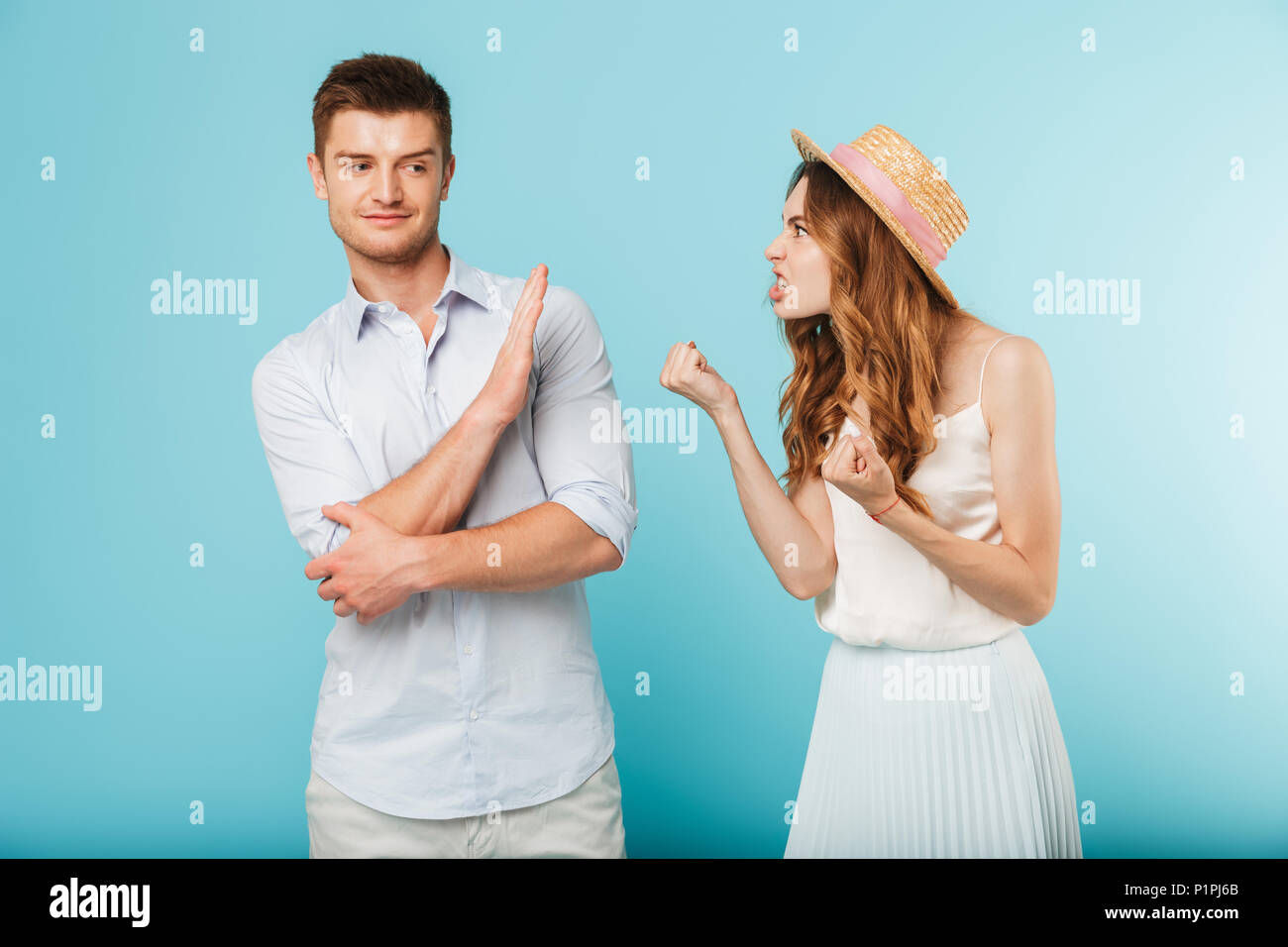 Image of young angry caucasian loving couple friends isolated over blue ...