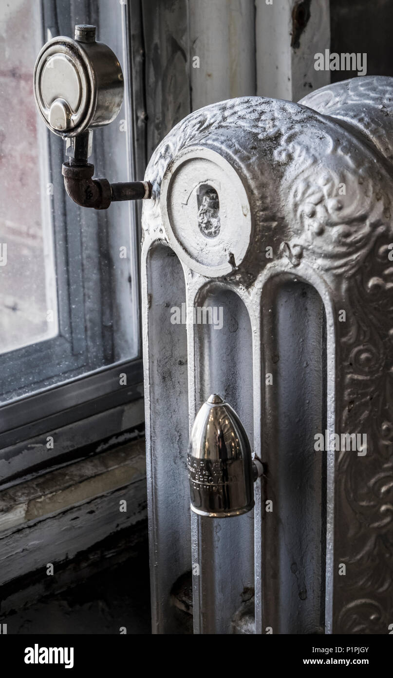 Original cast iron radiator in historical building; Winnipeg, Manitoba ...