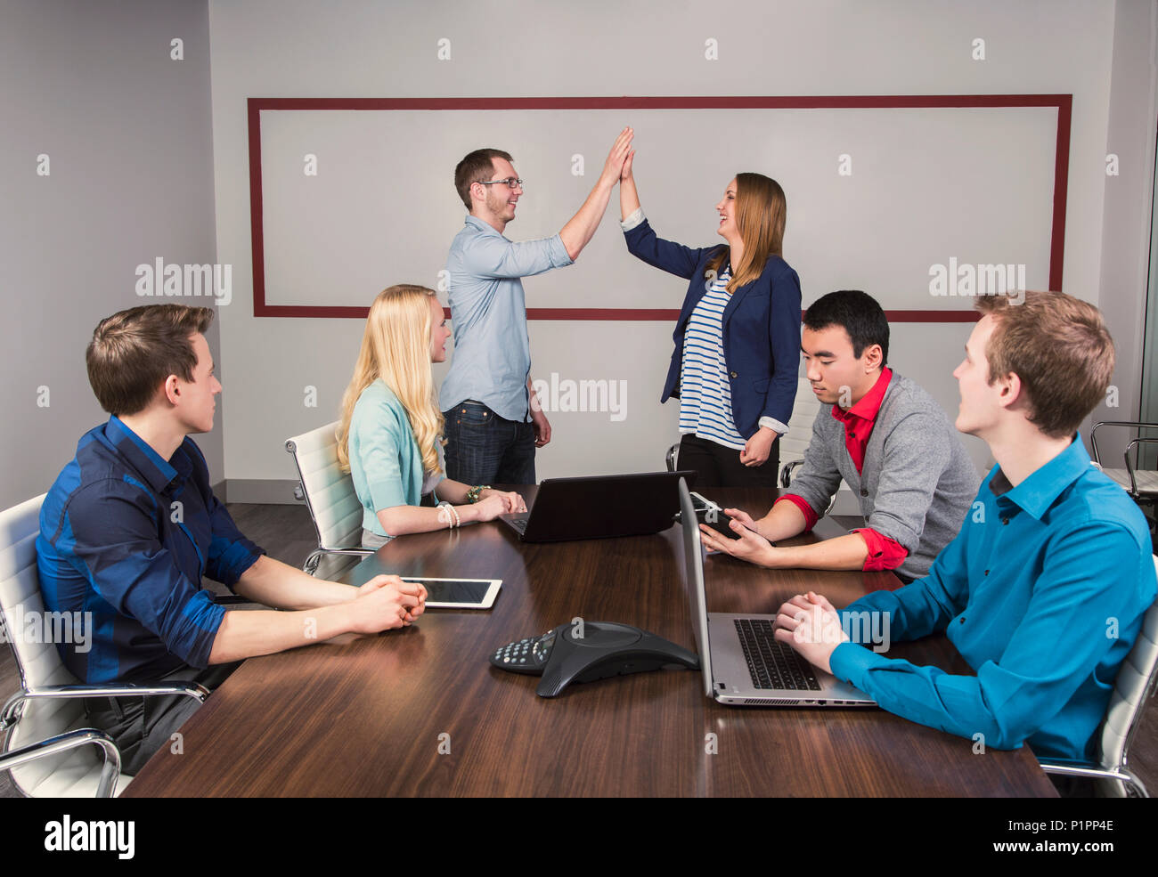 Young millennial business professionals working together in a ...
