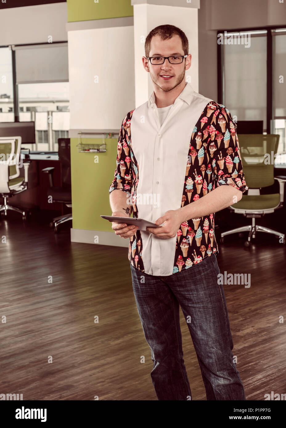 Portrait of a young millennial professional business man using ...