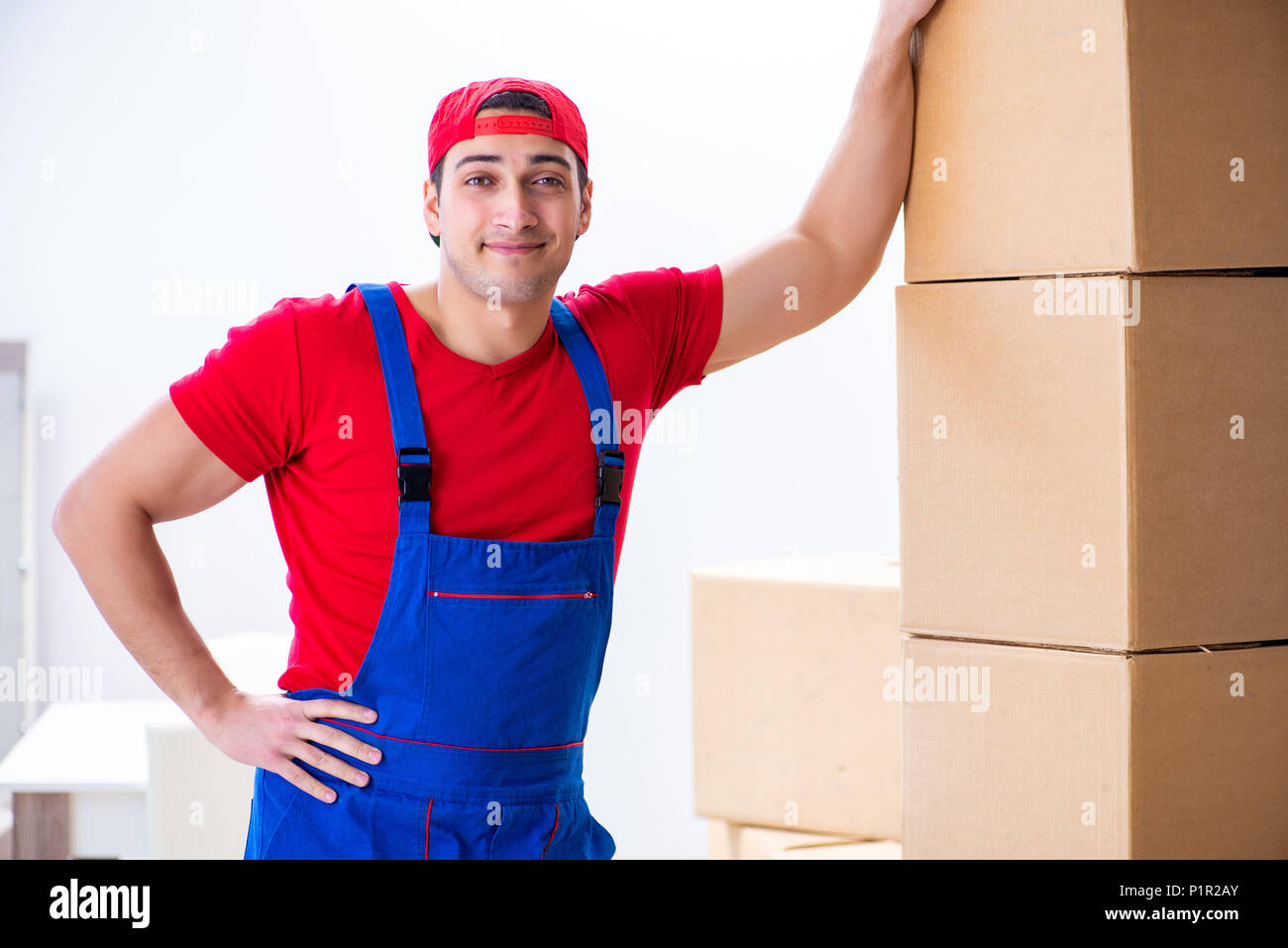 Contractor worker moving boxes during office move Stock Photo - Alamy