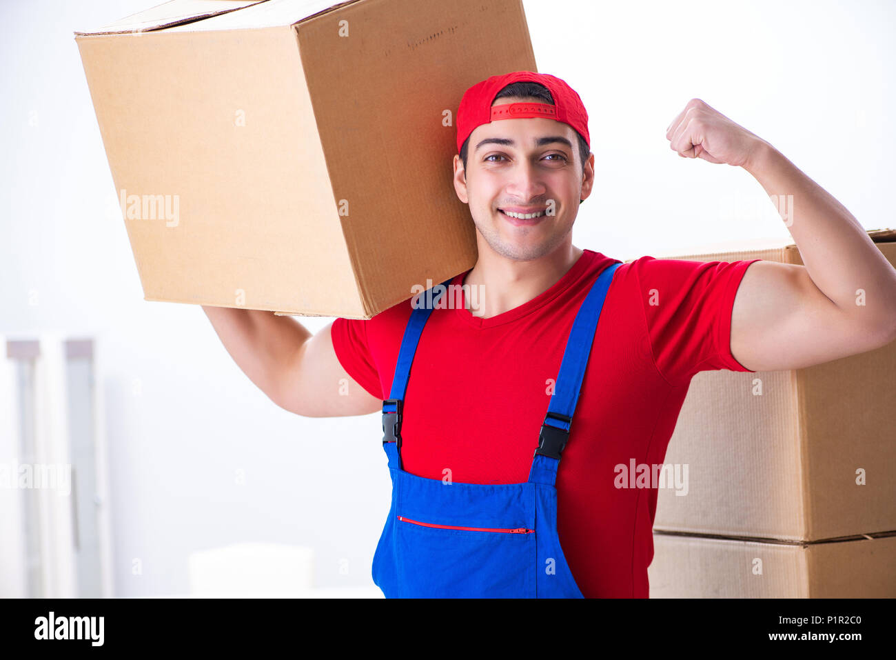Contractor worker moving boxes during office move Stock Photo - Alamy