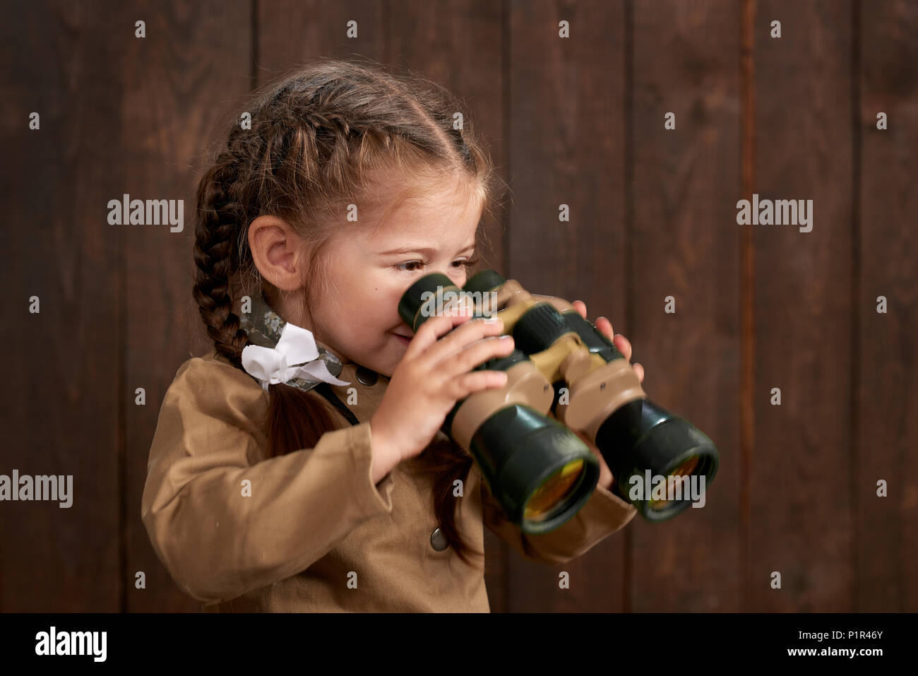 child girl are dressed as soldier in retro military uniforms Stock ...
