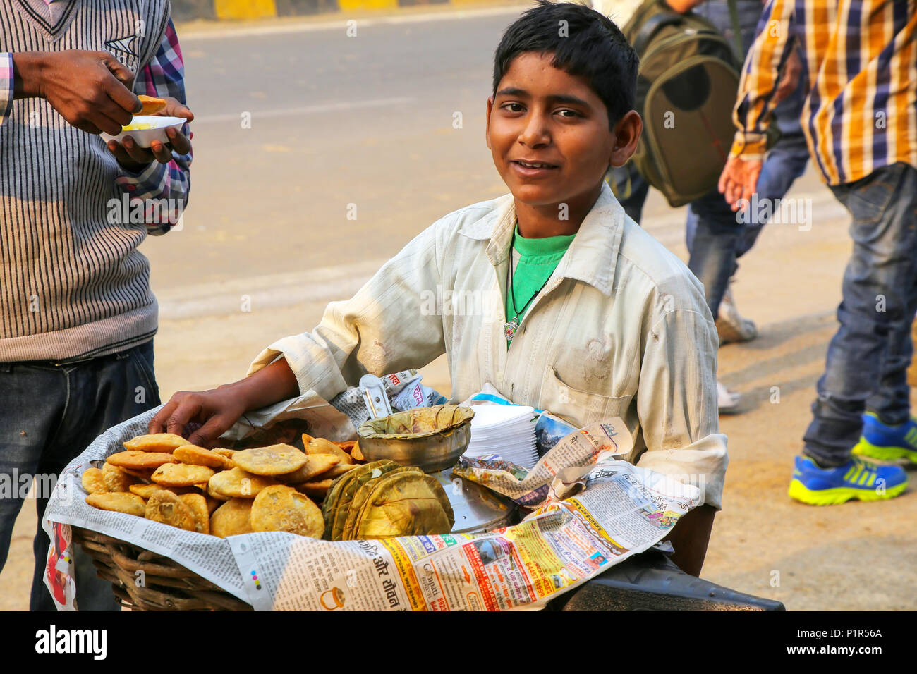 Indian boy selling at market hi-res stock photography and images - Alamy