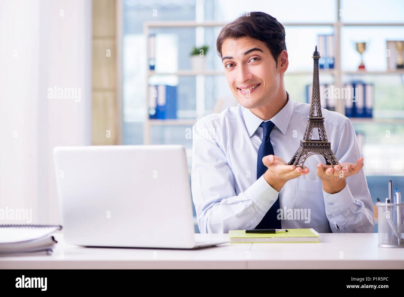 Sales agent working in travel agency Stock Photo - Alamy