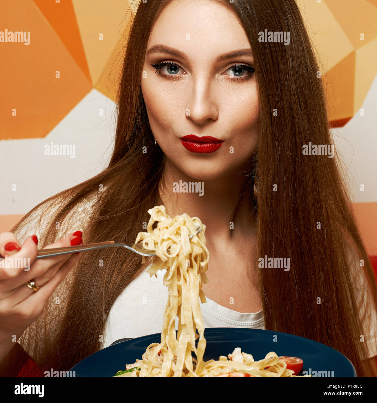 Portrait of attractive long haired woman with slightly ajar mouth and ...