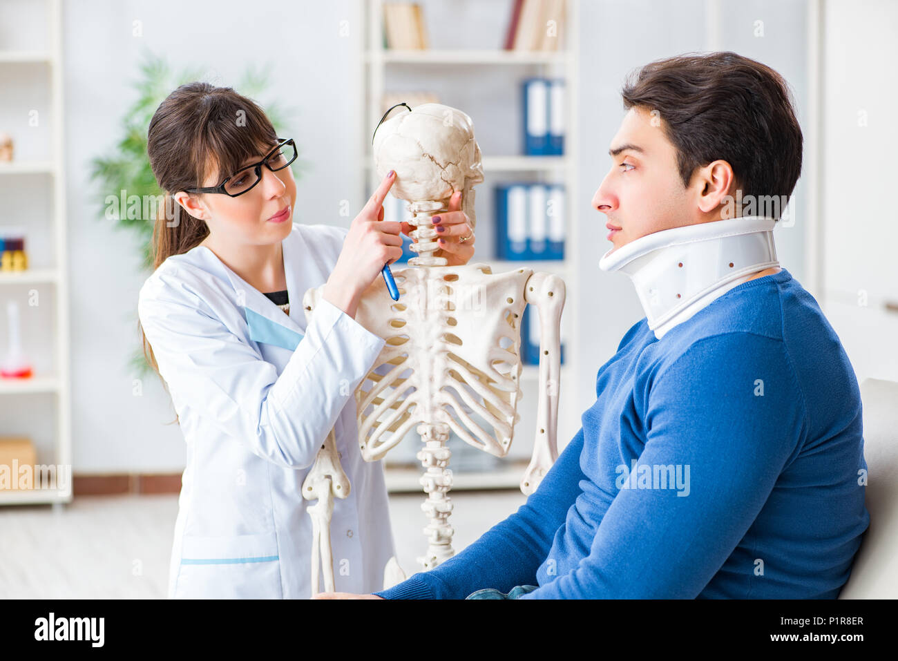 Doctor is explaining to patient with neck injury Stock Photo - Alamy