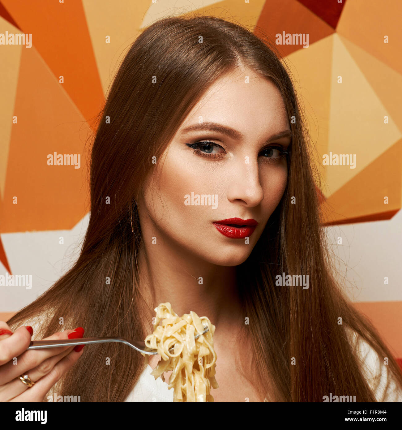 Portrait of attractive long haired woman with slightly ajar mouth and ...