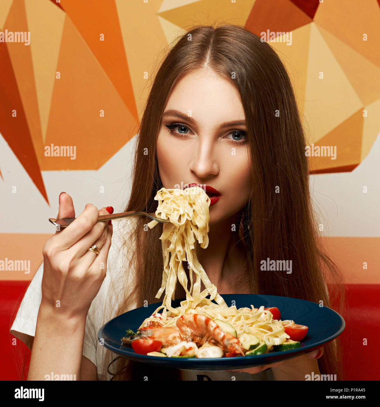 Portrait of attractive long haired woman with slightly ajar mouth and ...