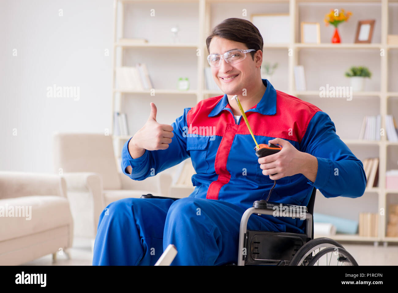 Disabled man measuring with meter Stock Photo - Alamy