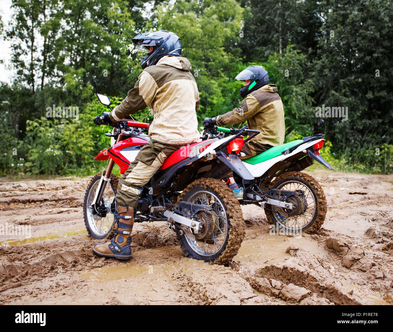 Man rides motorcycle through mud hi-res stock photography and images ...