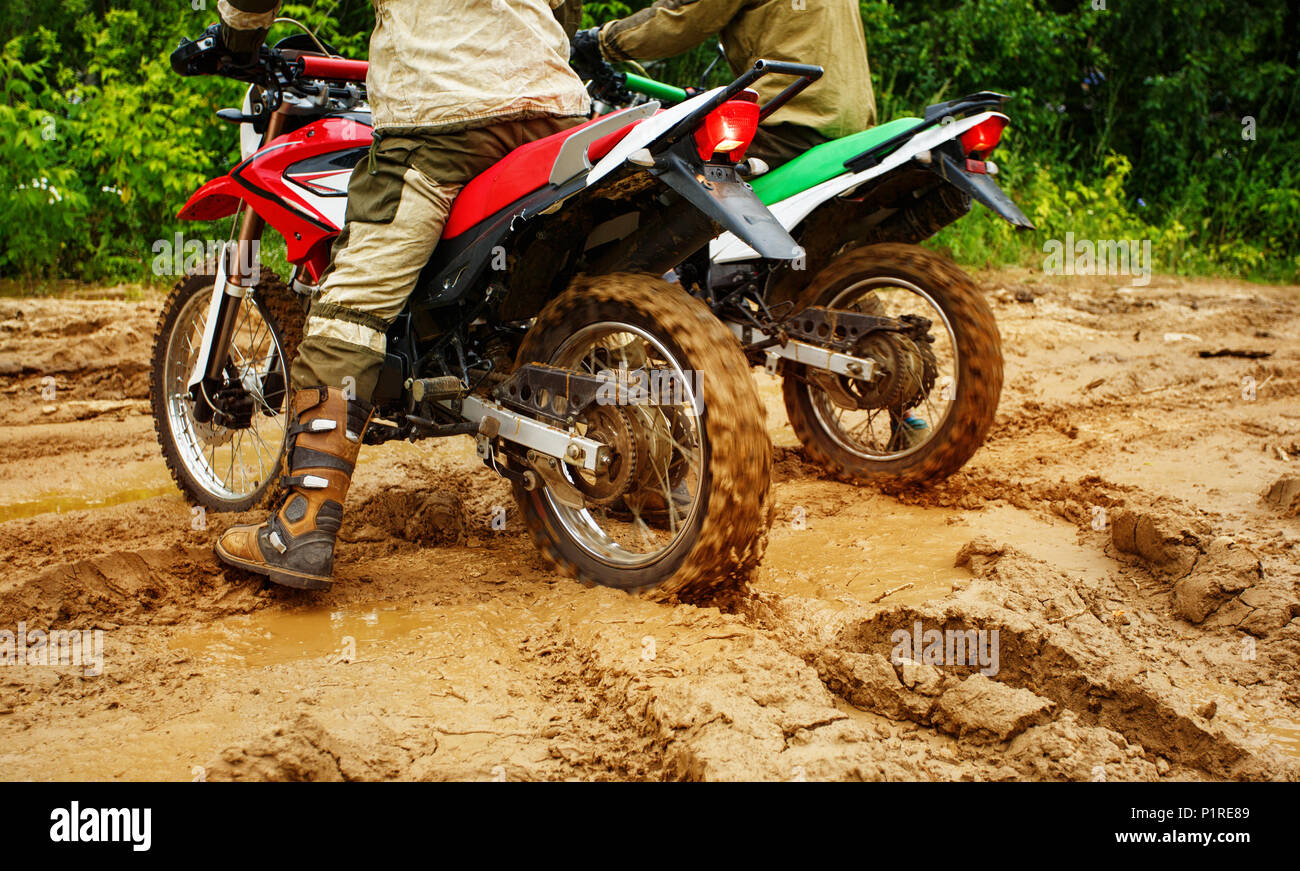 Man rides motorcycle through mud hi-res stock photography and images ...