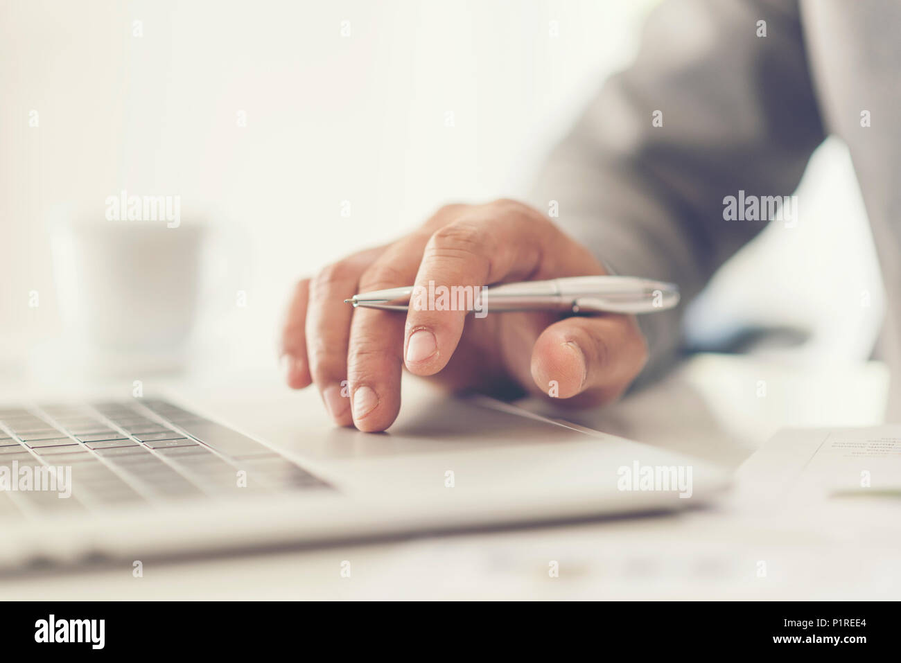 Close-up of male hands using laptop at office, man's hands typing on ...