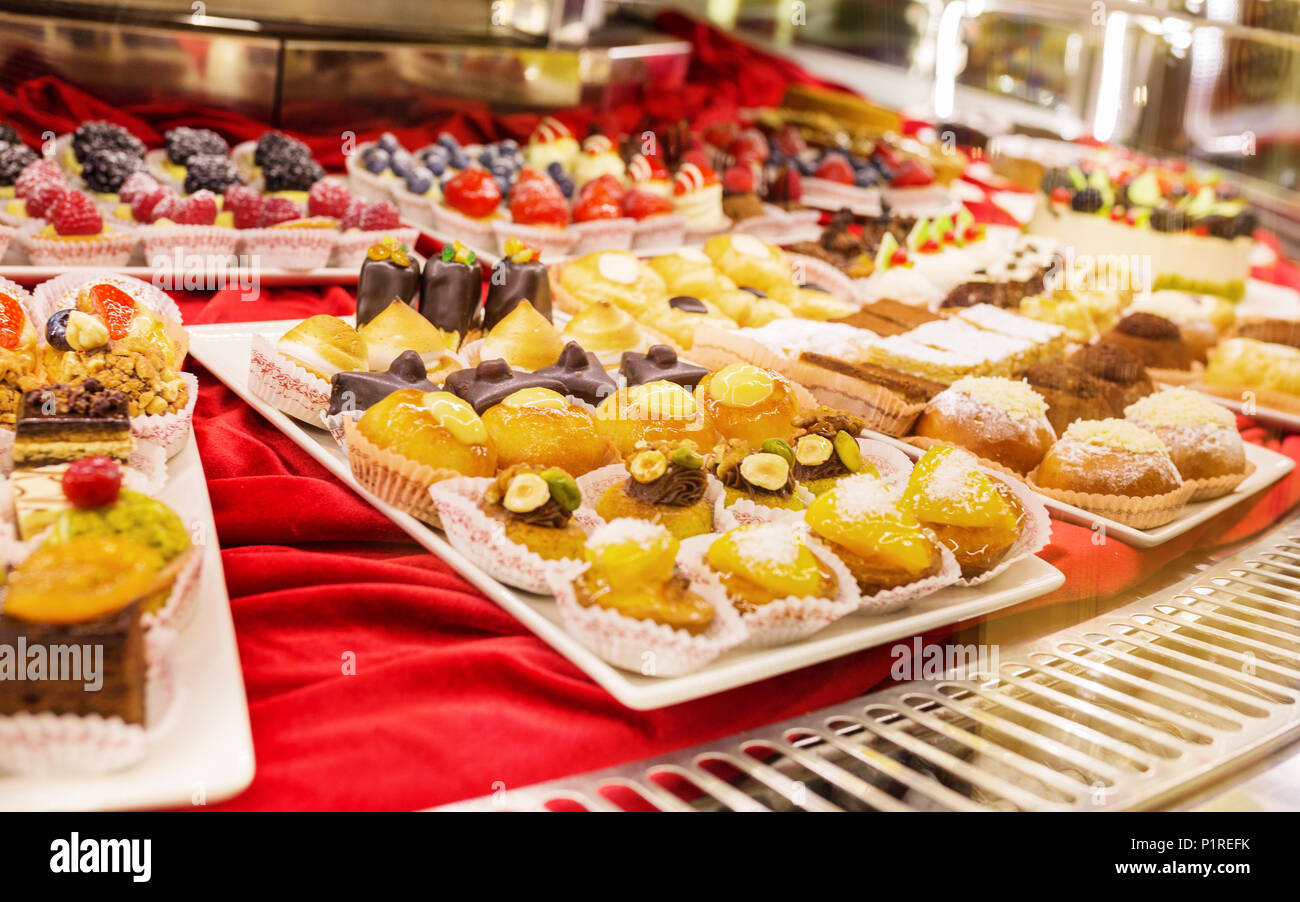 Cafe with a display of different cakes hi-res stock photography and ...