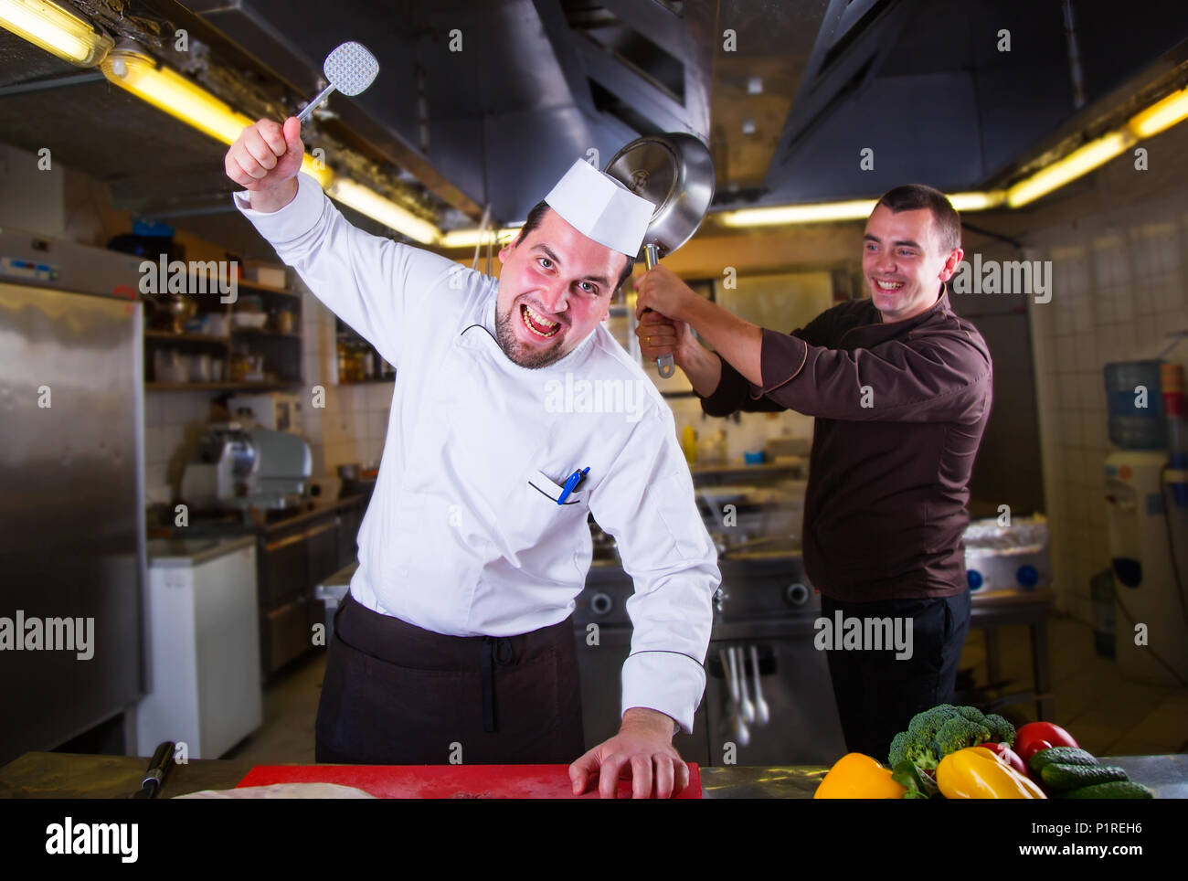 Chefs fighting in the kitchen Stock Photo - Alamy