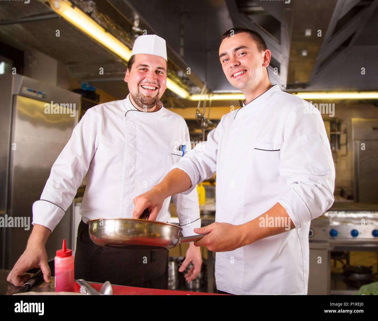 Two chefs cook together Stock Photo - Alamy