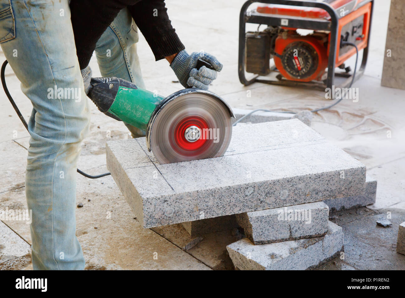 Worker with angle grinder Stock Photo - Alamy