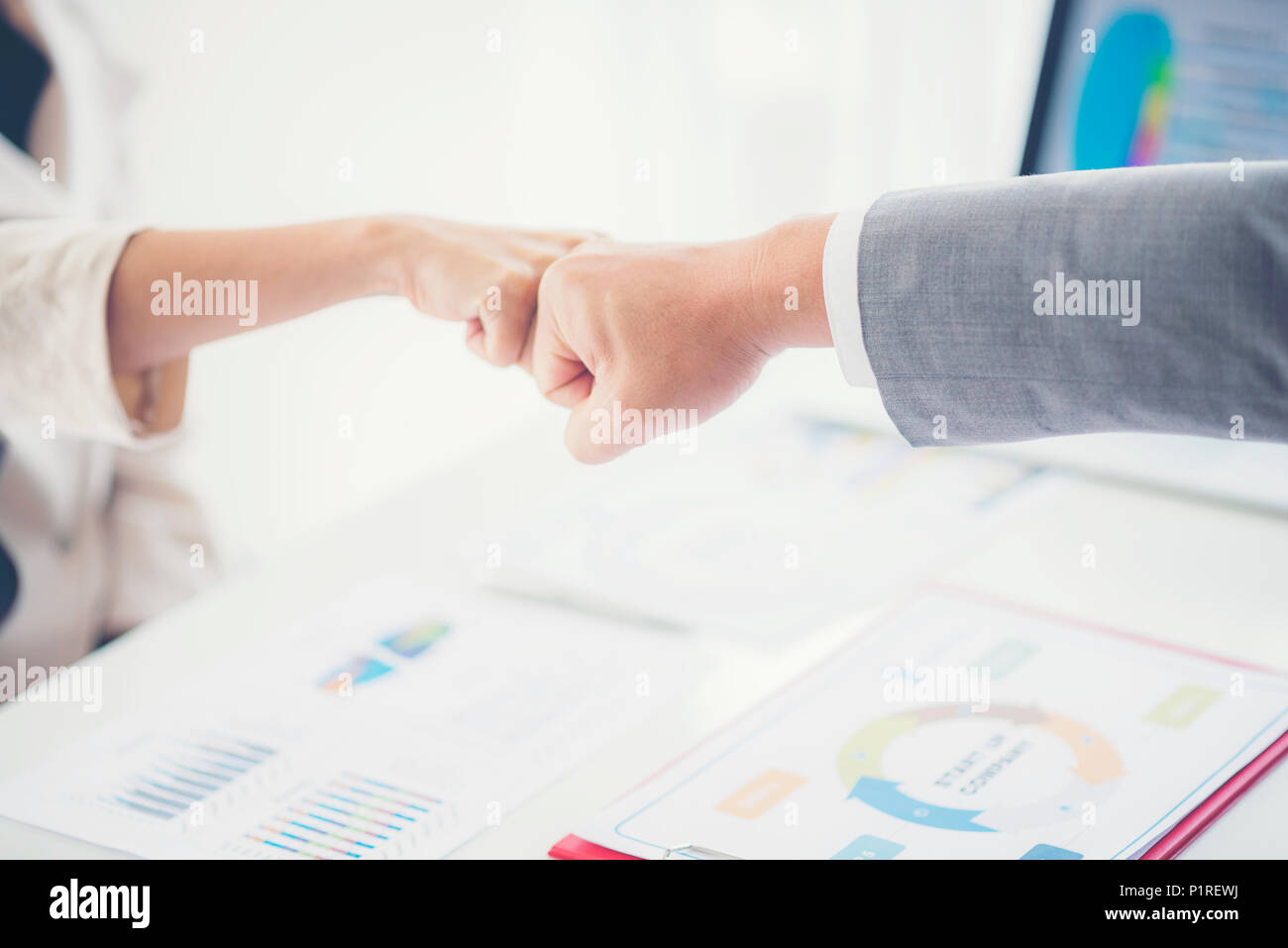 Teamwork business concept.Close up view of group of coworkers join hand together during their ...