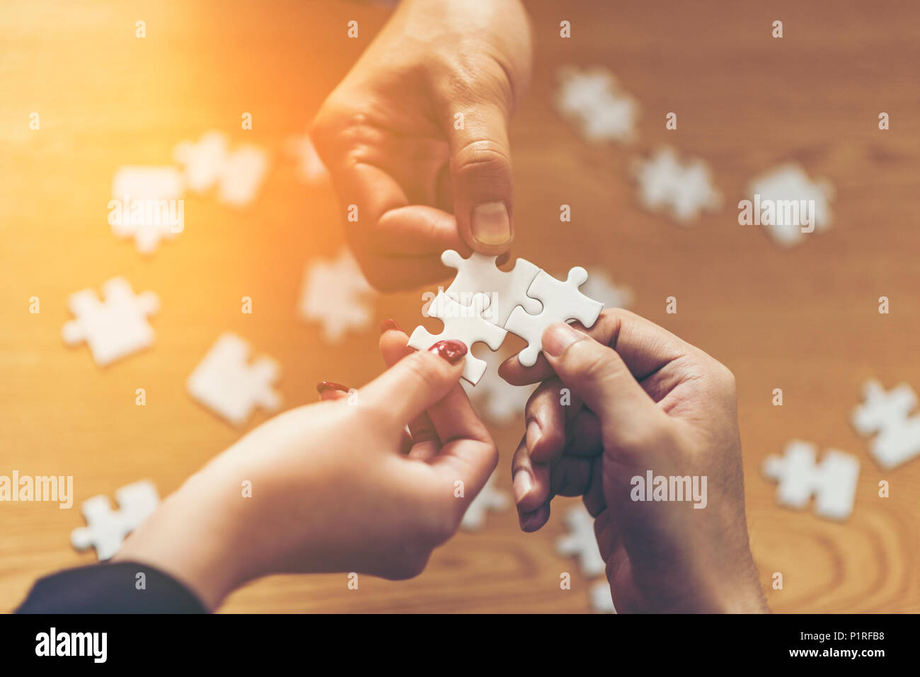 Teamwork of partners. Concept of integration and startup with puzzle ...