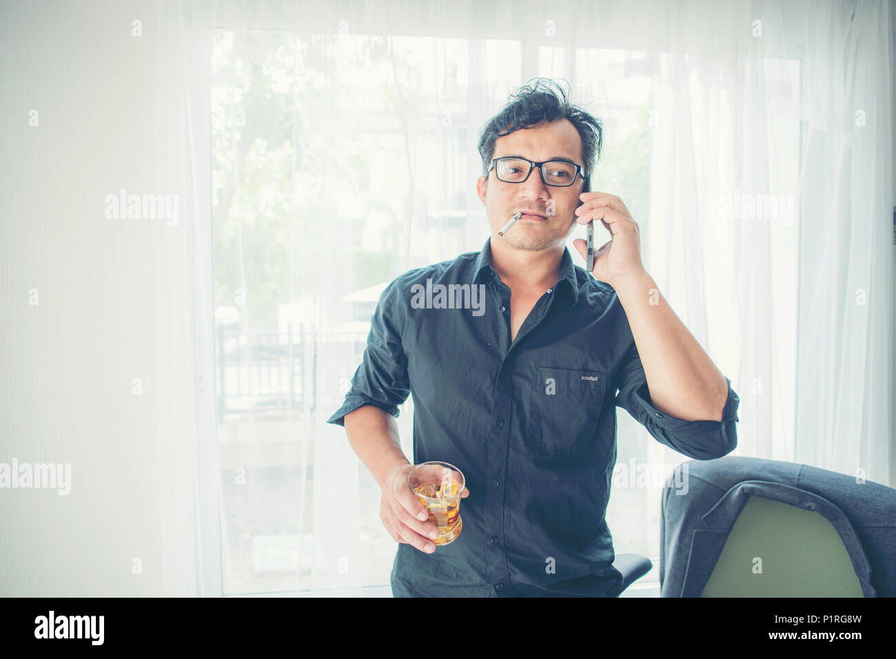 alcohol addiction - drunk businessman holding a glass of whiskey Stock ...