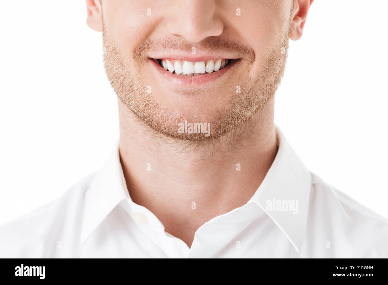 Close up of happy man's toothy smile isolated over white background ...