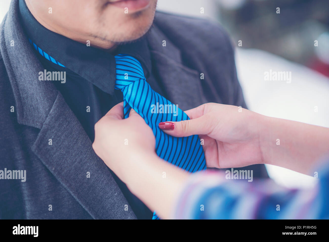 Woman Adjusting Shirt Collar High Resolution Stock Photography and ...