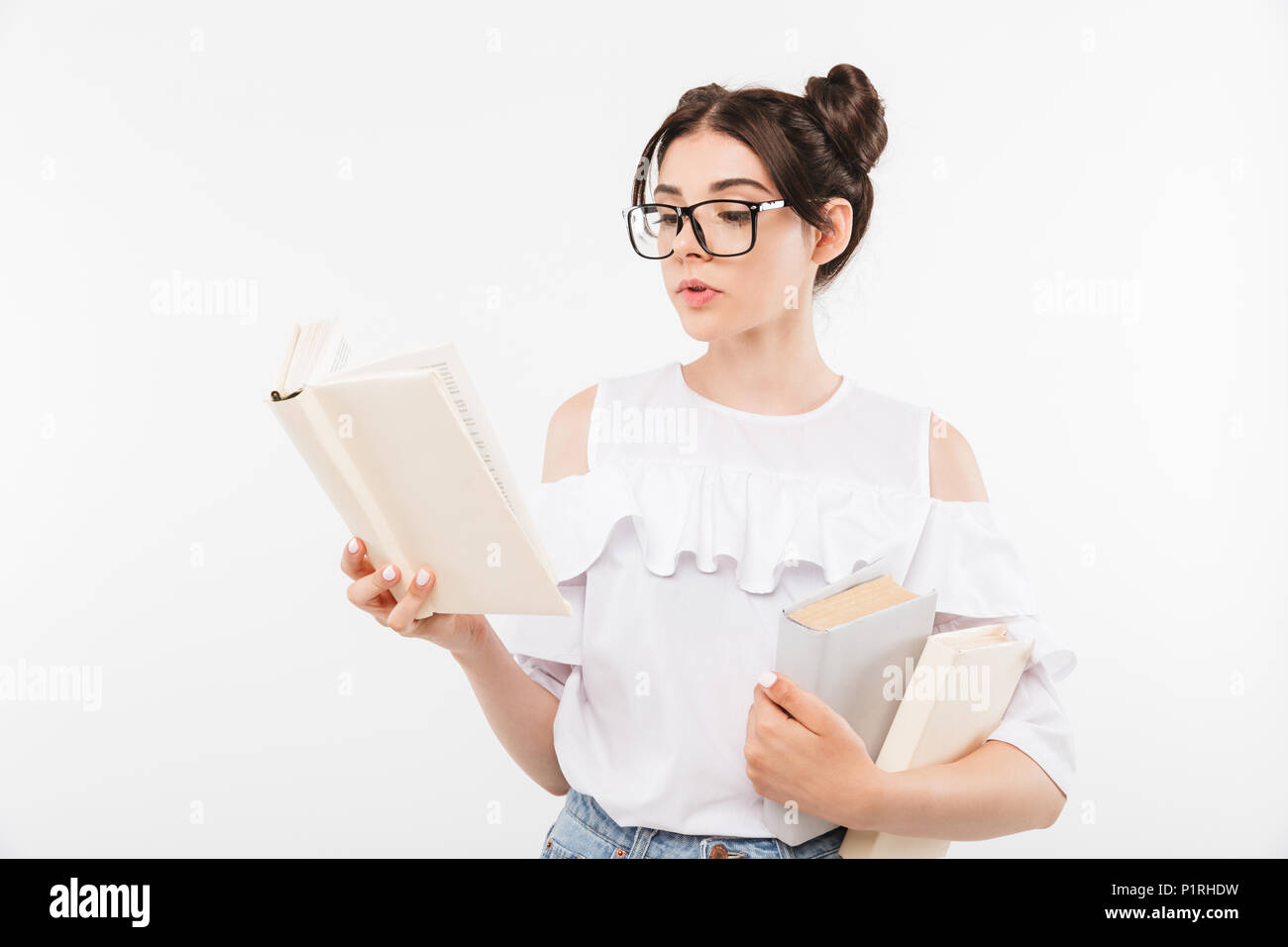 Photo of european smart student girl 20s having double buns hairstyle ...