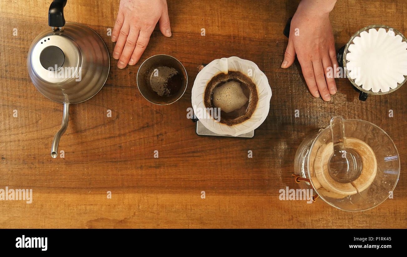 Hot water pouring trough coffee powder in the filter Stock Photo - Alamy
