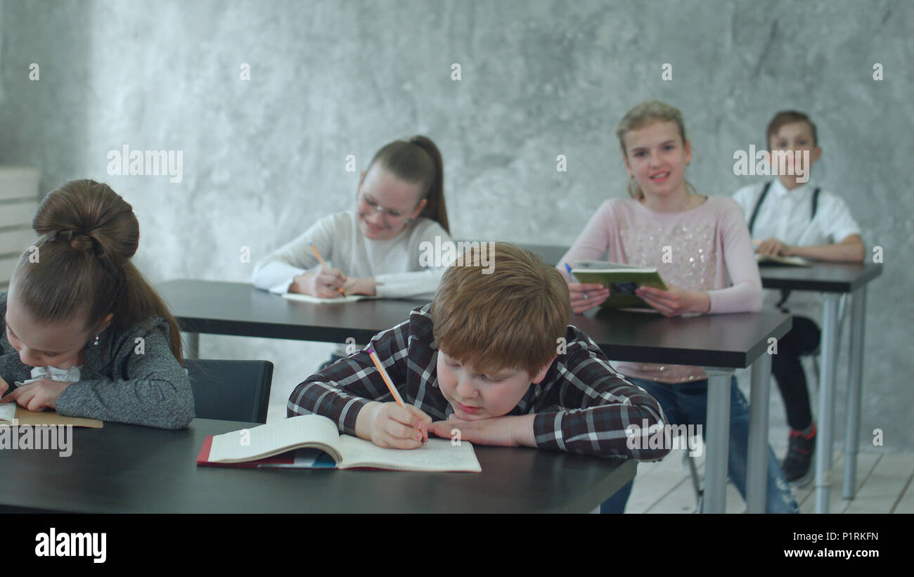 Group of elementary school kids running after lesson Stock Photo - Alamy