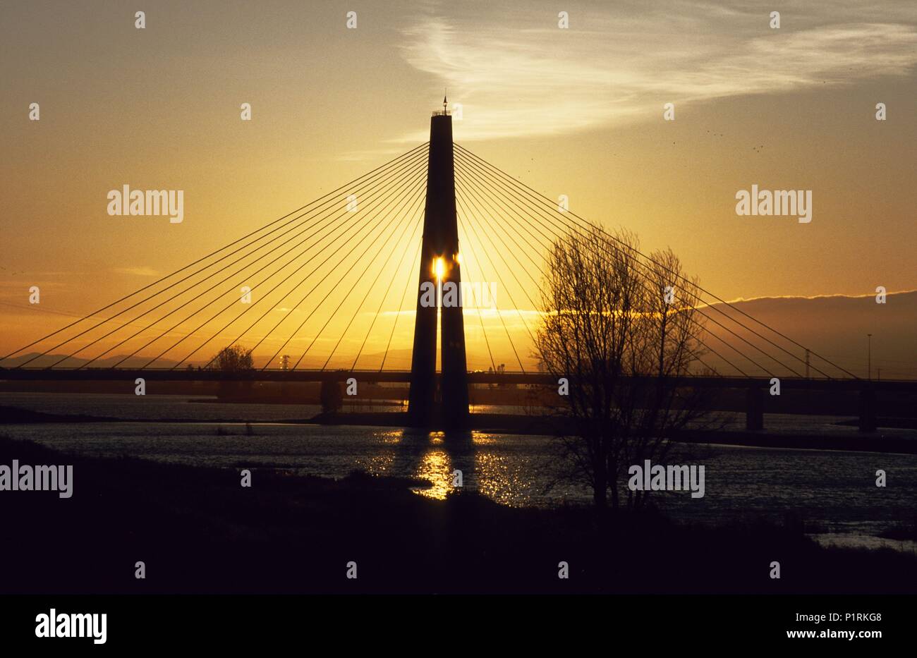 The River Guadiana, Real bridge, at the sunset Stock Photo - Alamy