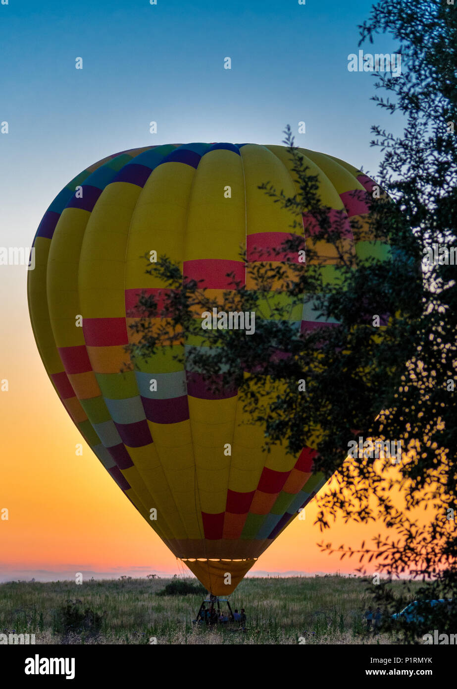 Hot Air Balloon Landing at sunset Stock Photo - Alamy