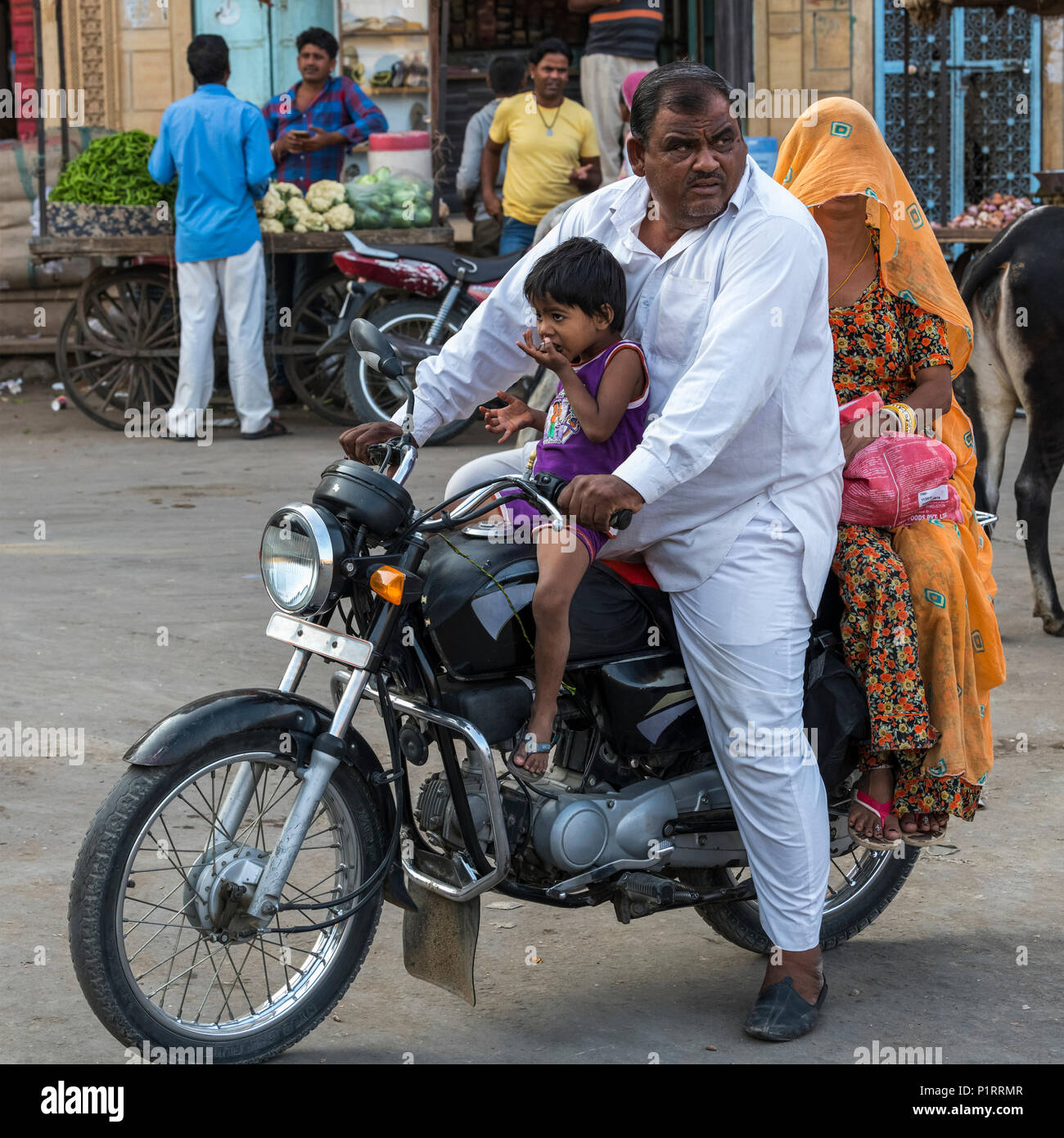 Three people riding a motorcycle hi-res stock photography and images ...