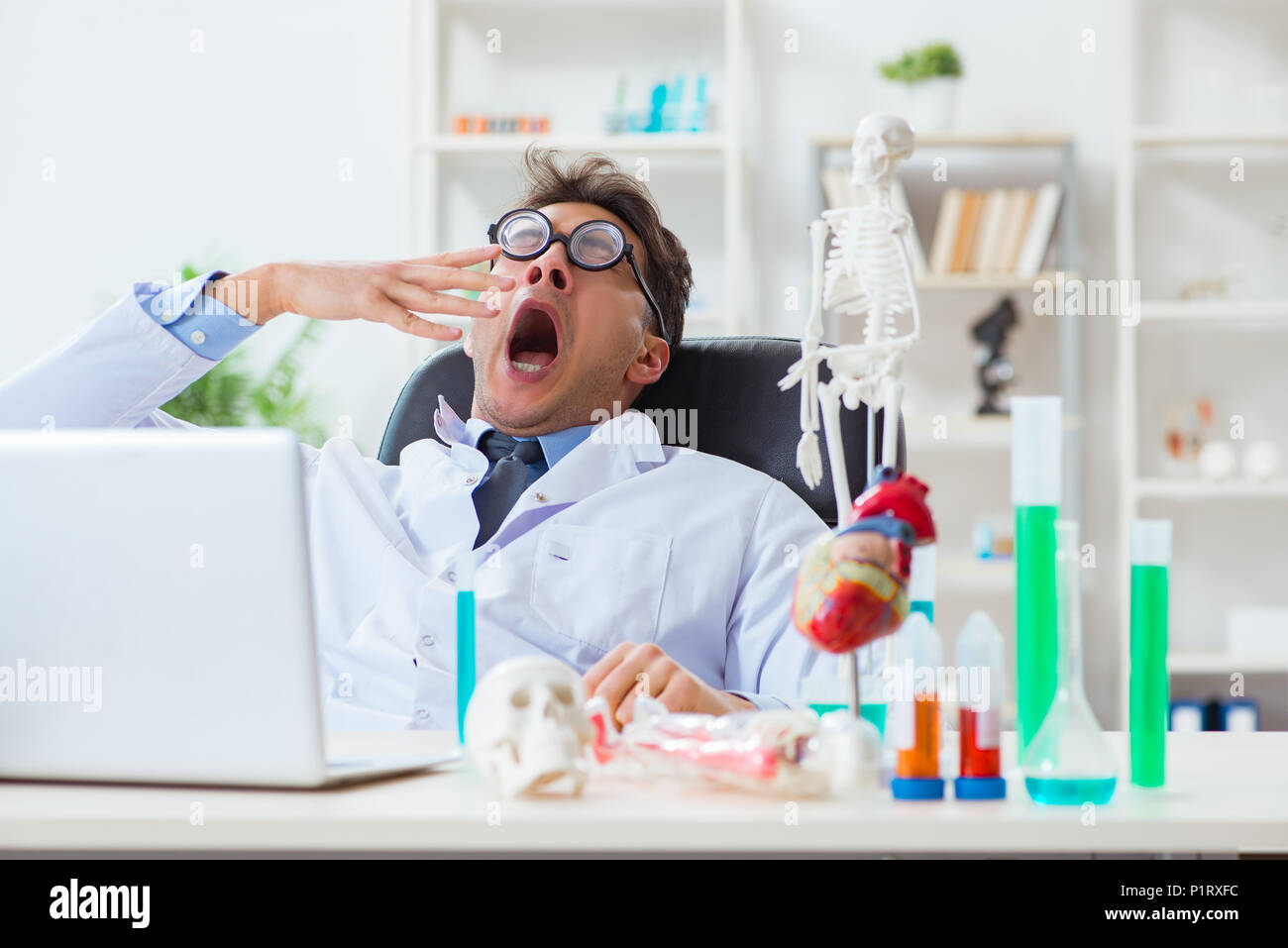Funny doctor having fun in hospital lab Stock Photo - Alamy