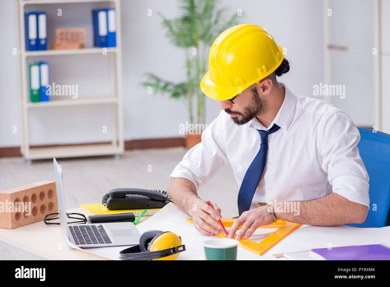 Architect working in his studio on new project Stock Photo - Alamy