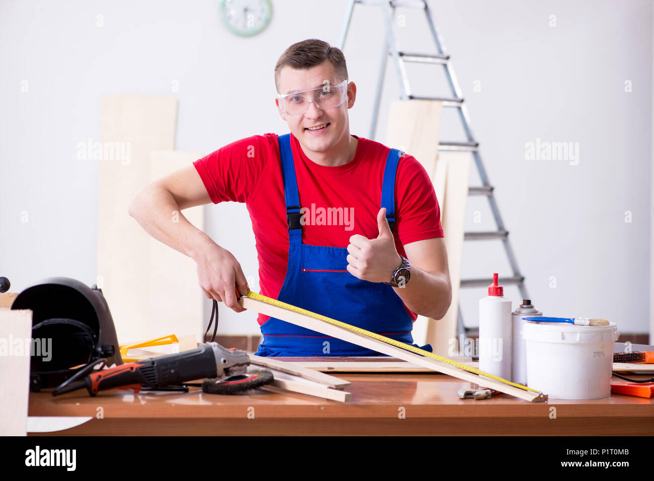 Contractor working in the workshop Stock Photo - Alamy