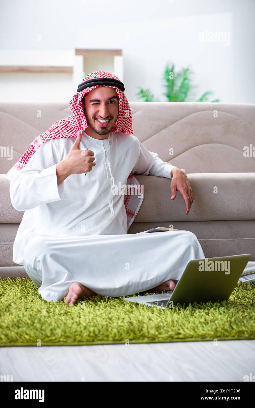 Arab man working at home on his work Stock Photo - Alamy