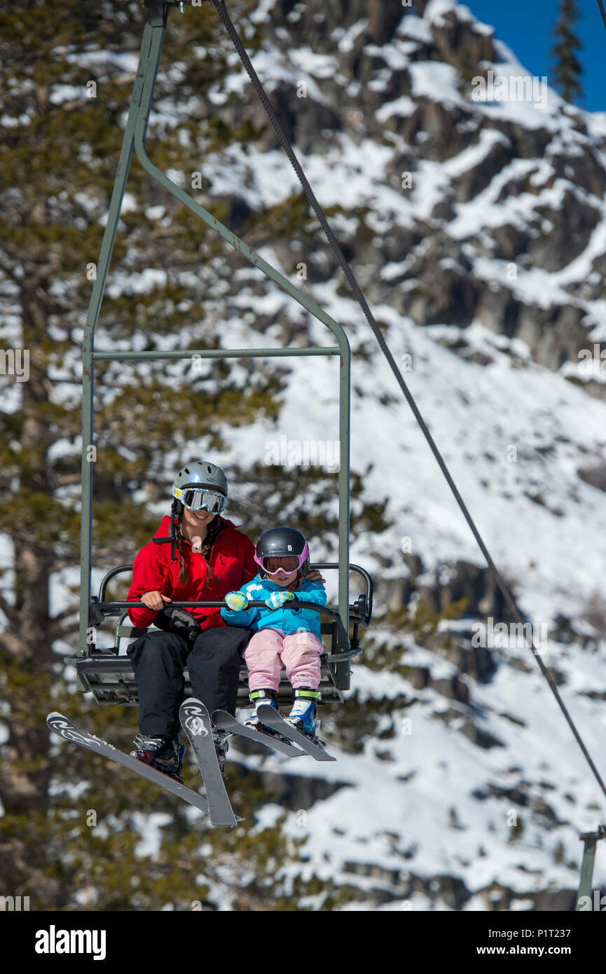 Mother and young daughter on a ski lift at Squaw Valley Ski Resort in ... Mother and young daughter on a ski lift at Squaw Valley Ski Resort in ...