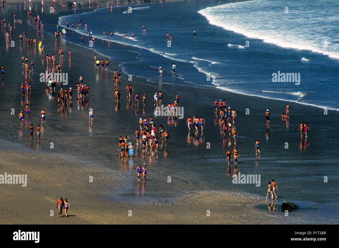 Deva, people on bath clothes walking at the beach (53 Stock Photo - Alamy
